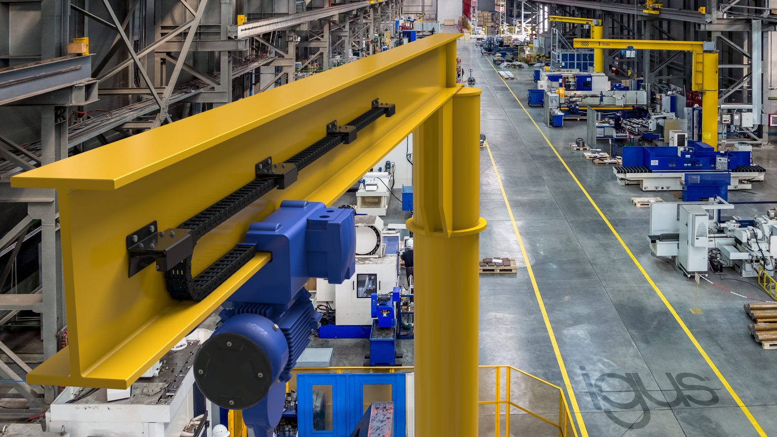Guide trough carriers save space & make jib cranes safer | igus®